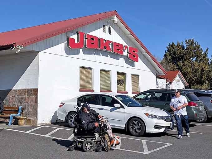 The bold red lettering against white walls creates a striking contrast that catches your eye from blocks away.