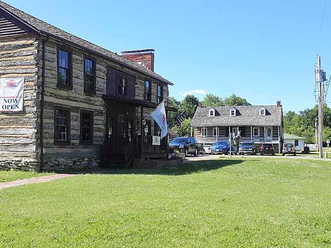 Weathered wood siding and a stone foundation tell stories of frontier days when this building was genuinely cutting-edge architecture.