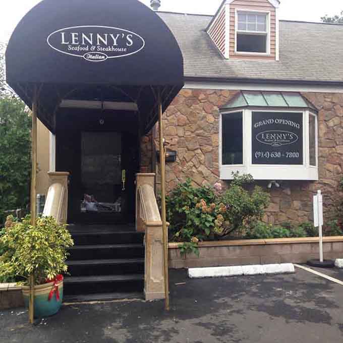 That dramatic black awning entrance practically rolls out the red carpet for your next memorable surf-and-turf adventure.