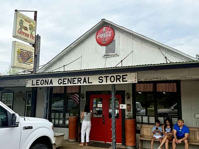 Red doors and families relaxing on benches capture the essence of a true community gathering place.
