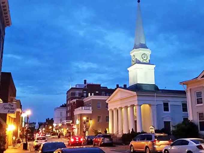 That white steeple stands proud against the evening sky, a beacon guiding folks home since before your grandparents were born.