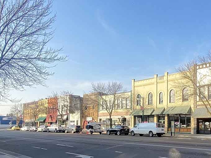 Morning light kisses these storefronts just right, revealing architectural details that modern strip malls forgot were possible.