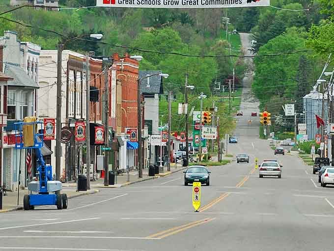 Rolling hills frame this peaceful main street where the biggest traffic jam involves waiting for a friendly wave.
