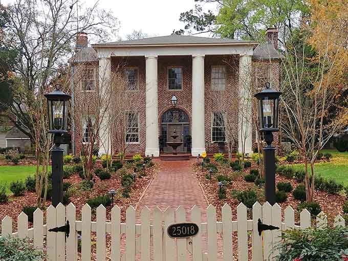 Stately columns and brick walkway showcase Southern architecture preserved perfectly for generations to admire and cherish.