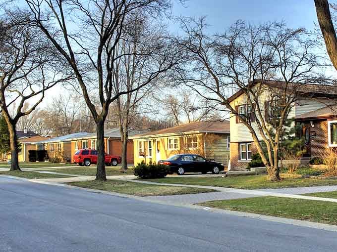 Mature trees shade these well-kept ranch homes where neighbors still wave from driveways and kids play outside.