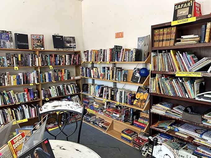 Floor-to-ceiling bookshelves packed with stories prove that one person's finished novel becomes another's perfect weekend escape plan.