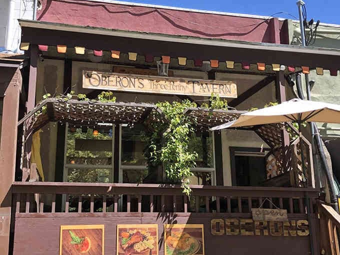 Sunny afternoon light illuminates the charming entrance where fantasy meets reality in this storybook-worthy cocktail destination.