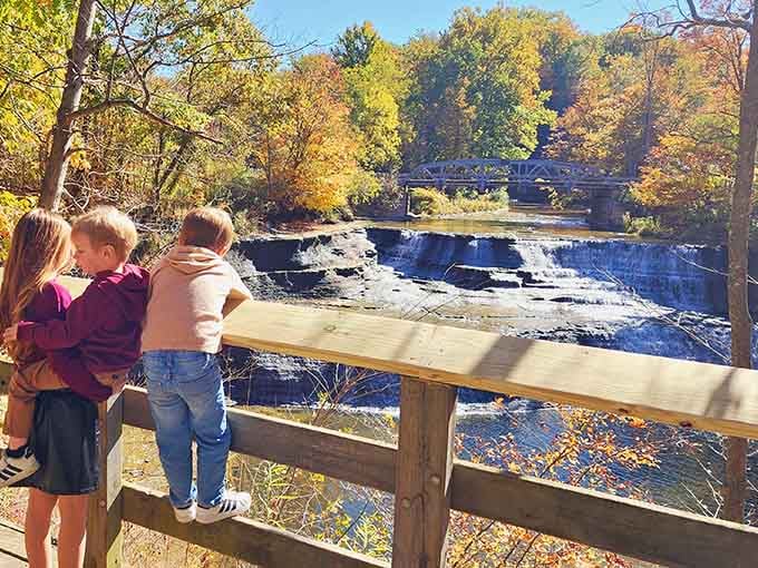 The wooden viewing deck offers front-row seats to this cascading performance that never takes intermission.