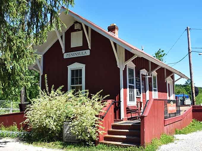 The charming red depot with its vintage appeal makes you wish trains still stopped at every small town.