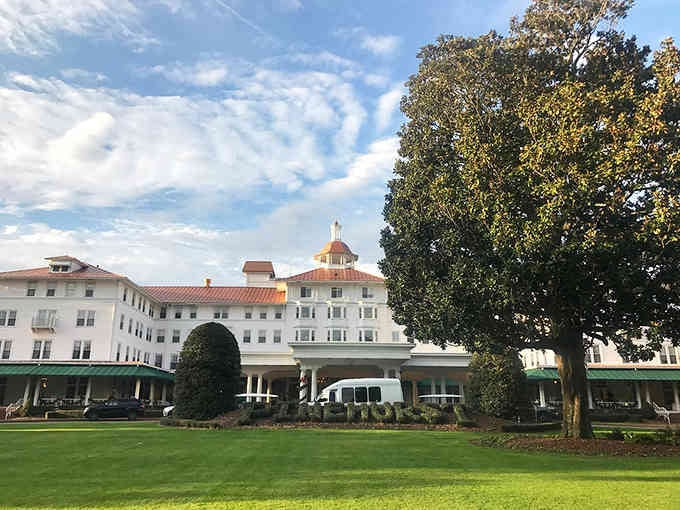 This grand white resort sits majestically on manicured lawns, looking exactly like the elegant getaway your parents remember fondly.