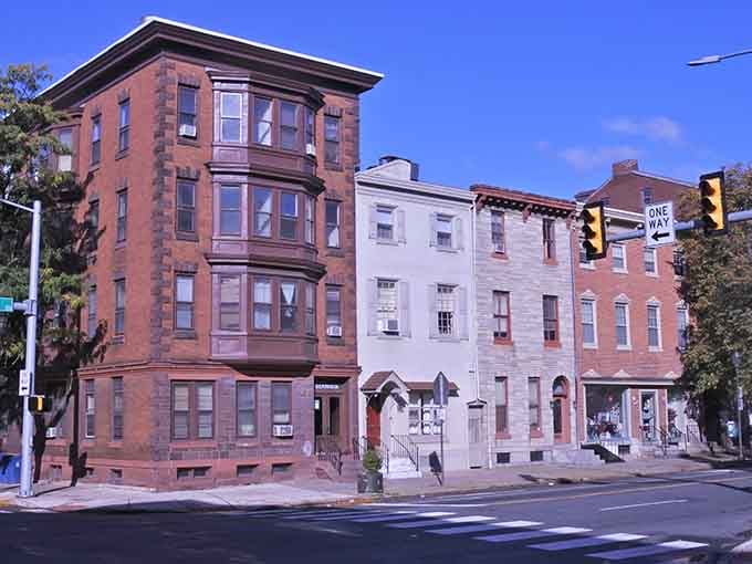 Historic row houses line quiet streets where neighbors still know each other's names and share morning greetings.