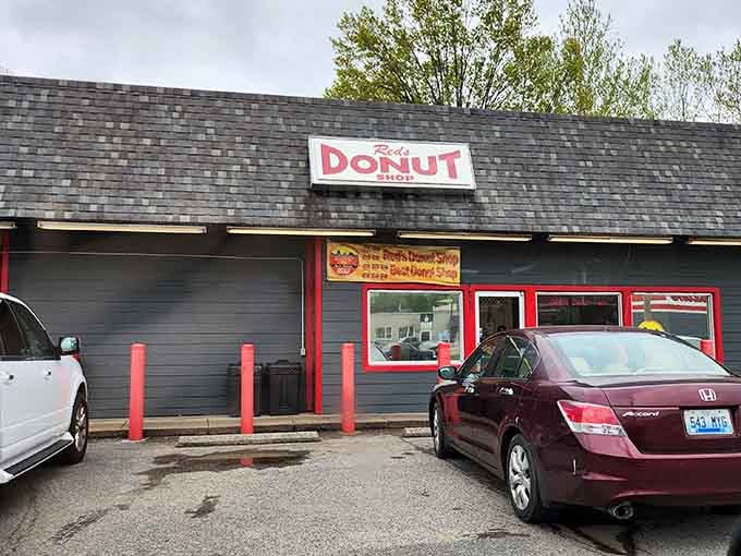 Those bold red window frames draw your eye straight to the promise of warm, delicious treats just inside.