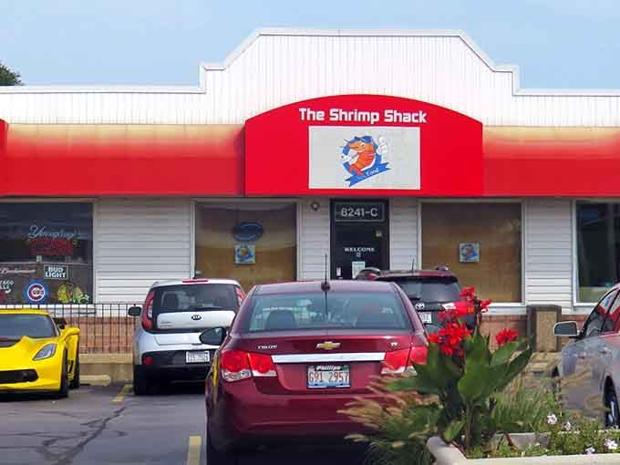 The red and white color scheme with cheerful mascot creates instant nostalgia for classic American roadside seafood joints everywhere.