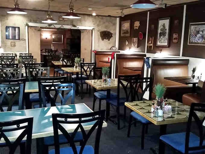 The dining room blends ranch-style charm with comfortable seating, perfect for settling in and savoring every tender, flavorful bite.