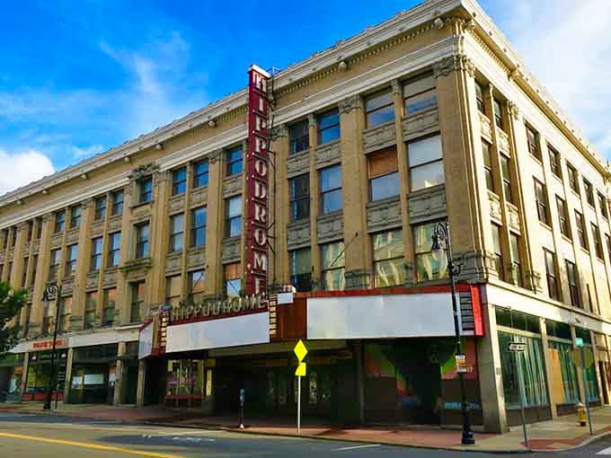 That vintage theater marquee beckons like an old friend, promising entertainment without the big-city ticket prices.