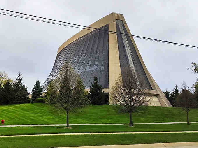 Manicured lawns surround this soaring temple, where ancient geometry meets thoroughly modern design sensibilities.