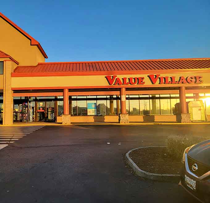 Golden hour sunshine bathes the storefront in warm light, making even thrift shopping feel like a glamorous adventure.