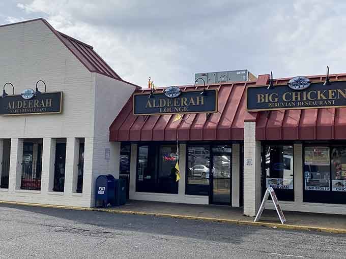 Multiple restaurant signs clustered together mean serious competition for your appetite, and honestly, everyone wins in this delicious scenario.