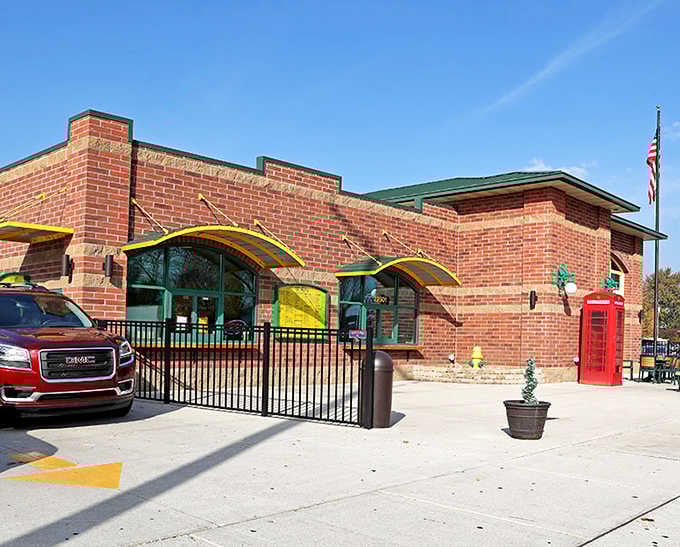 The brick building and patriotic flag wave proudly, declaring this custard stand a true neighborhood treasure worth celebrating.