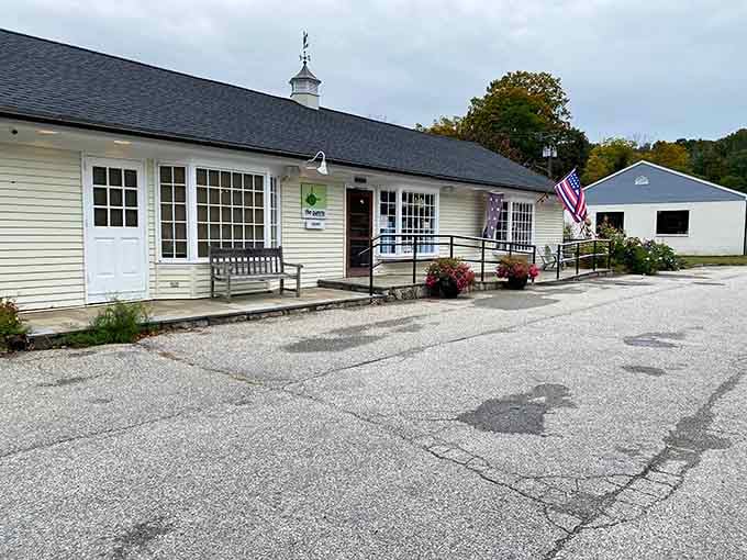 Gravel parking and flowering planters signal the kind of no-fuss spot where the food does all the talking.