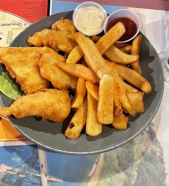 Golden-fried halibut with thick-cut fries delivers that classic fish and chips experience we all crave.