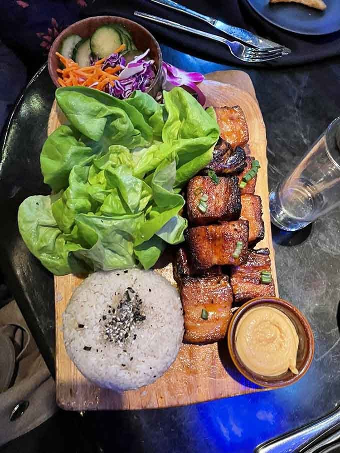 Pork belly cubes glistening like edible jewels, served with lettuce wraps for those pretending to be health-conscious.