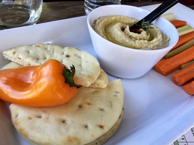 Fresh vegetables and hummus prove that healthy choices can look this good when presented with a little Mediterranean flair.