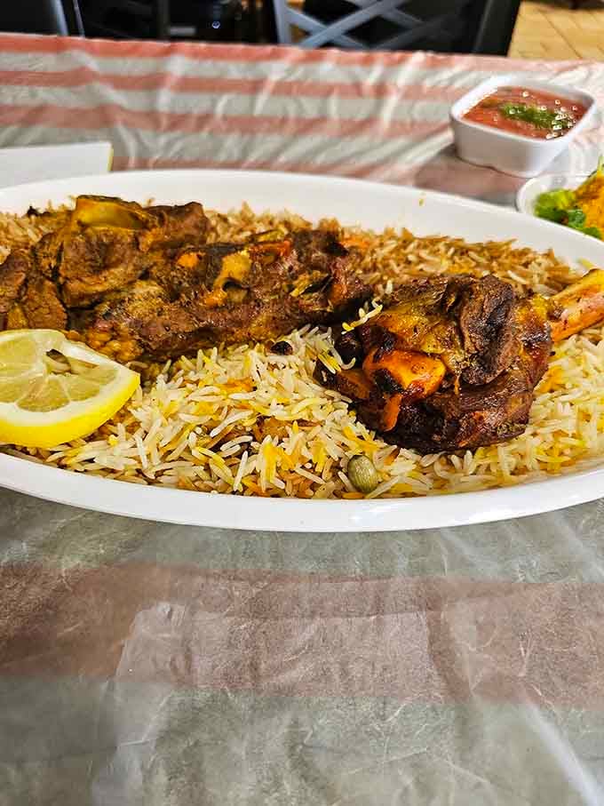 Tender lamb chops arranged over perfectly seasoned rice, proving that presentation matters almost as much as taste.