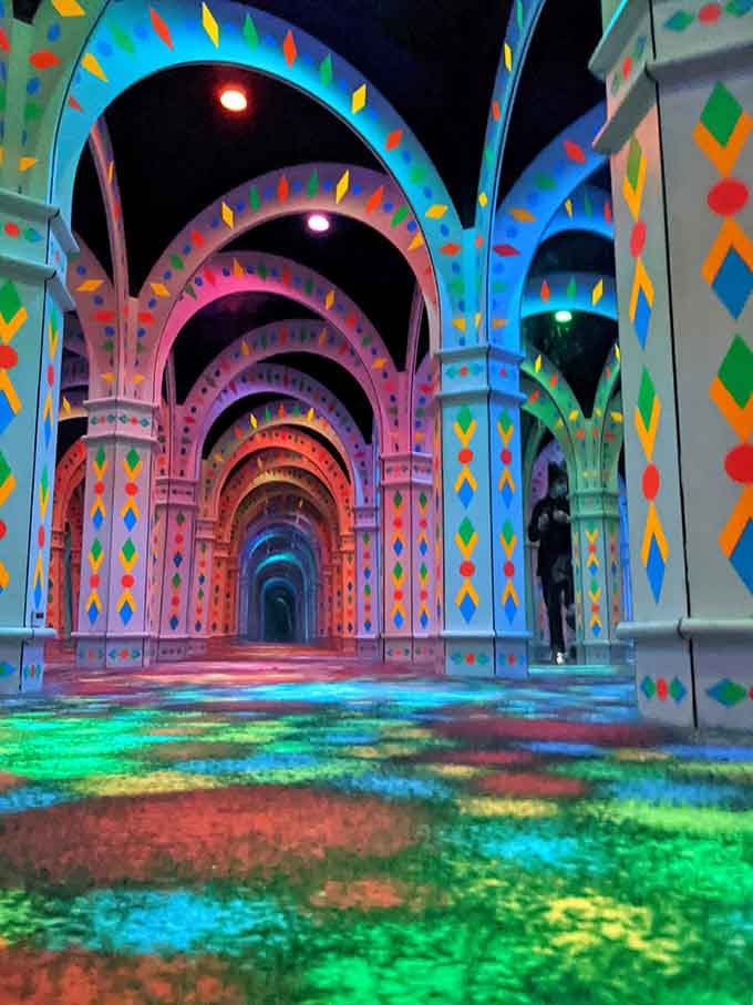 Looking up reveals layers upon layers of geometric patterns reflected into a mesmerizing infinity loop.