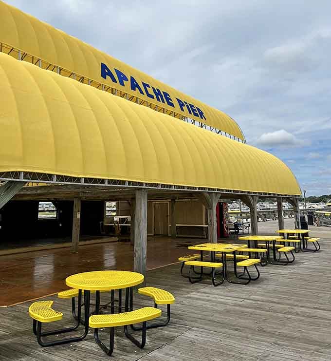 That cheerful yellow canopy is like a beacon of good times, promising shade, snacks, and seaside memories.