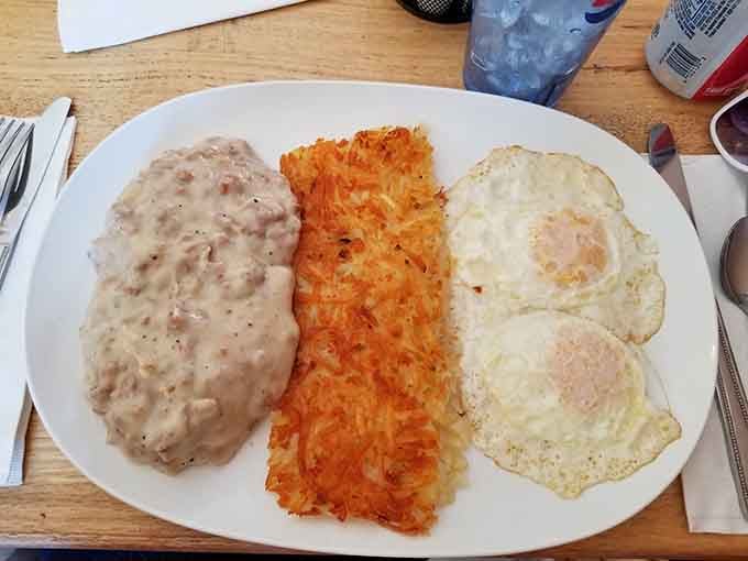 Biscuits drowning in sausage gravy, alongside hash browns and sunny-side-up eggs: comfort food that could solve most of life&rsquo;s problems.