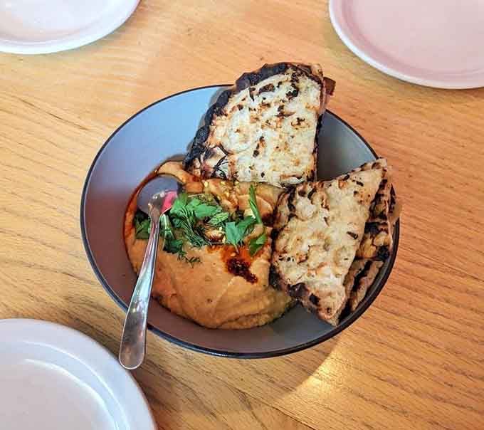 Brown butter hummus topped with pistachios and chili oil proves that sometimes the best things come in bowls, not boxes.