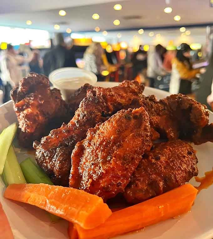 Wings glistening with sauce, ready to fuel your next gaming marathon or pinball championship run.
