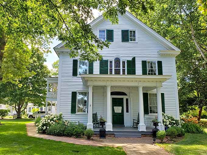 This pristine white beauty with green shutters represents the kind of architectural grace that makes Berlin's historic district absolutely irresistible.