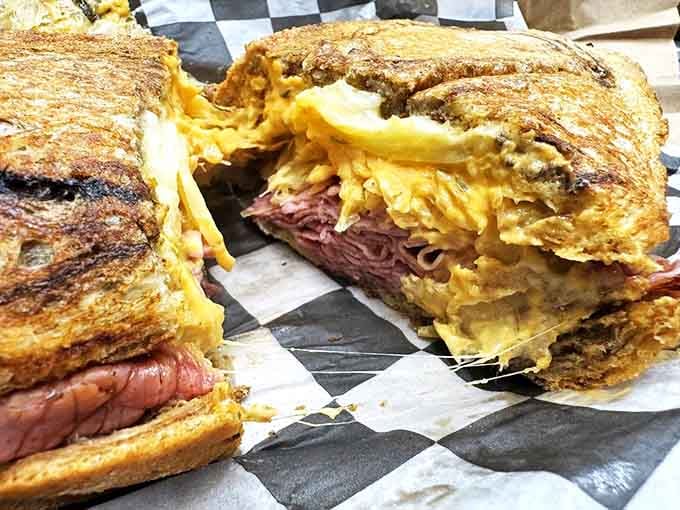 That Reuben cross-section reveals the kind of generous filling that makes you reconsider your life choices, happily.