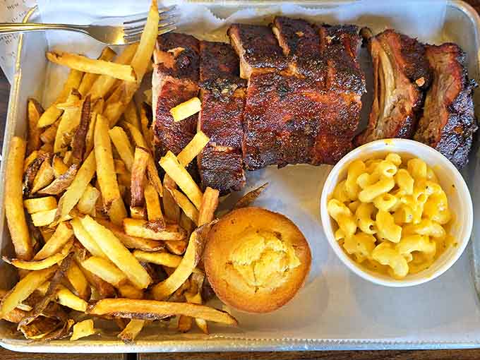 That mahogany crust on those ribs paired with crispy fries creates the kind of plate that stops conversations mid-sentence.