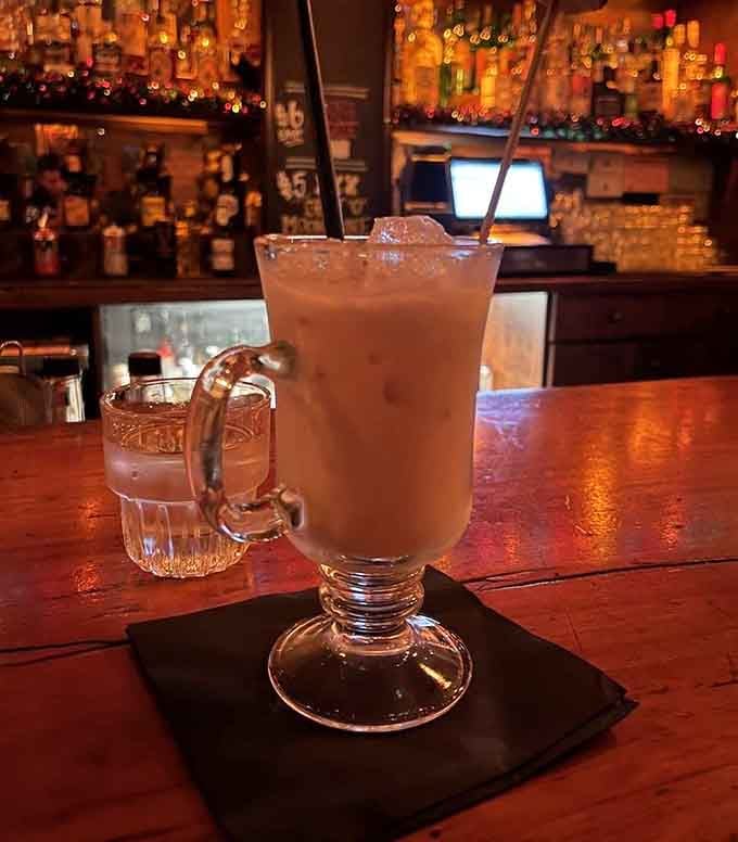 The Roasted Marshmallow cocktail arrives looking like summer camp memories mixed with grown-up decisions and zero regrets.
