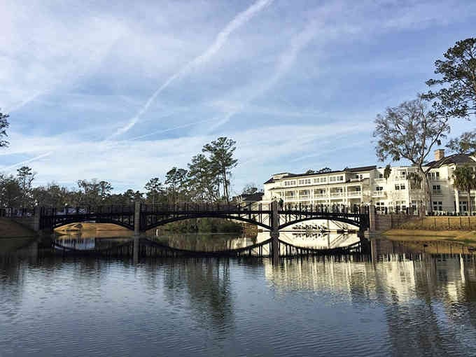This pedestrian bridge connects neighborhoods while providing Instagram-worthy reflections that professional photographers would envy and charge hundreds for.