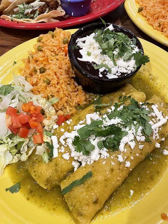 Those enchiladas swimming in green sauce are basically a vacation to Mexico without the airport security hassle.