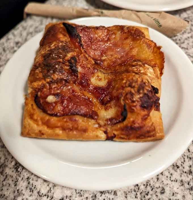 Caramelized onions and melted cheese on buttery pastry make this tart the sophisticated cousin of pizza.