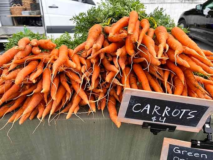 Carrots with their tops still attached, proving they didn't spend three weeks in a distribution center before meeting you.