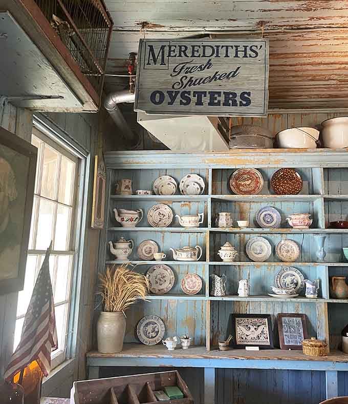 Delicate china and everyday wares line the shelves, reminding us that life continued even in troubled times.