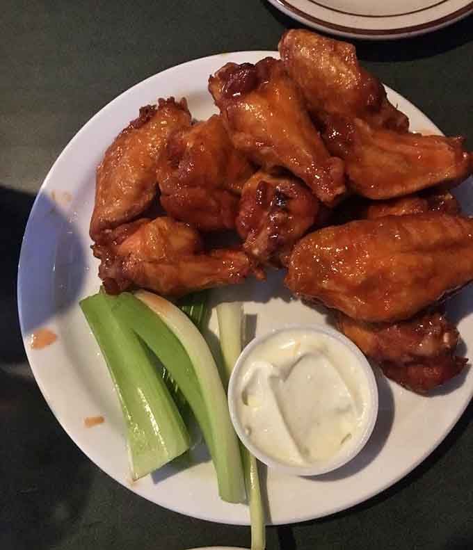 Wings glazed in sweet maple heat, proving that breakfast syrup has a legitimate place in your dinner plans.