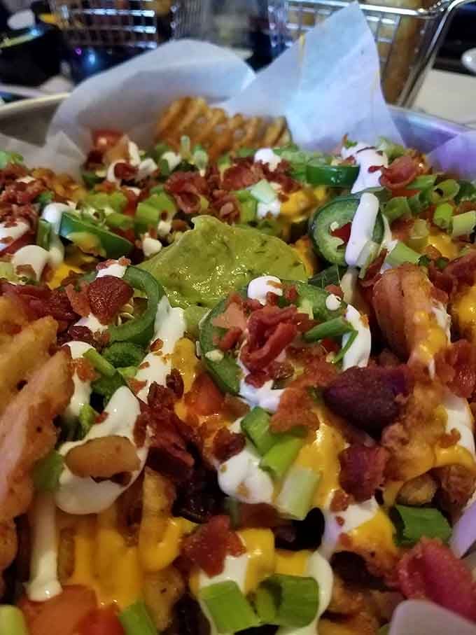 Irish Nachos piled high with toppings, proving that potatoes and nachos were always meant to be together.