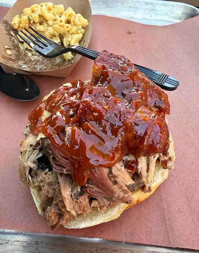 The El General Patton sandwich arrives stacked so high with pulled pork it practically requires a battle plan to eat it.