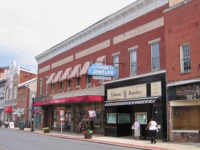 Main Street storefronts that remember when shopping meant conversations, not just credit card swipes and exits.
