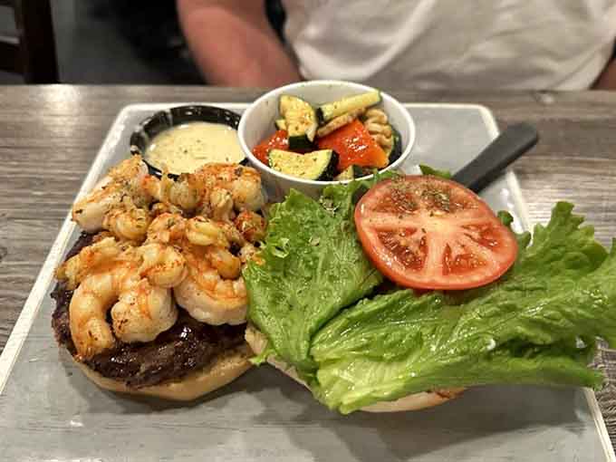 When surf meets turf on a bun, beautiful things happen, especially with grilled shrimp crowning that juicy patty.