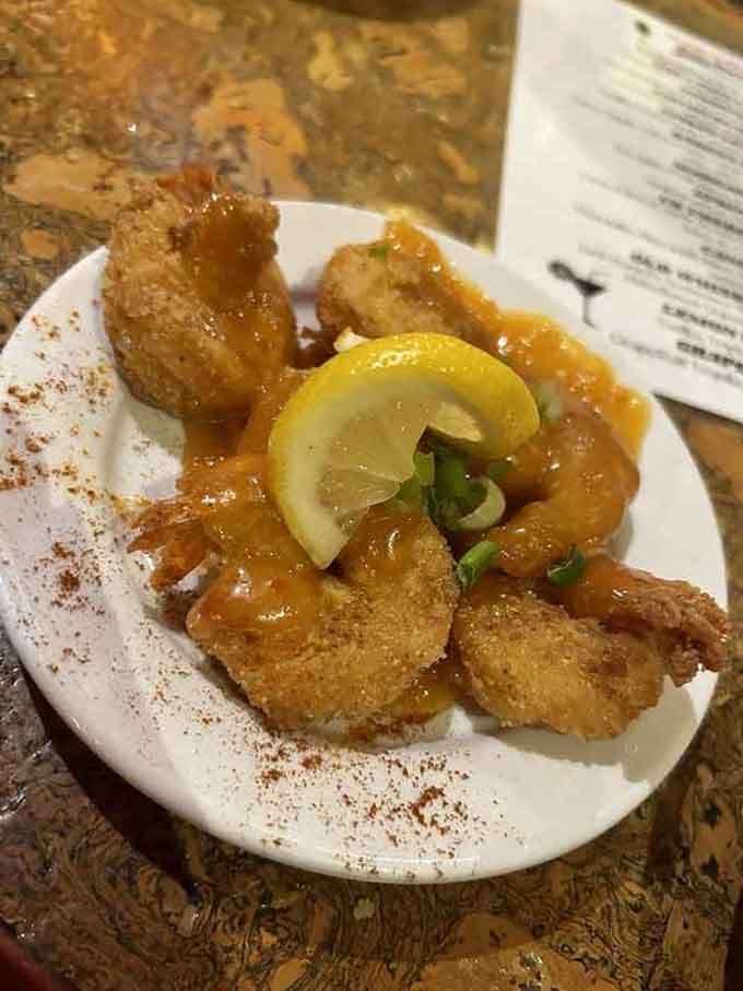 Fried shrimp so perfectly golden they practically glow, because sometimes simple preparations yield the most spectacular results.