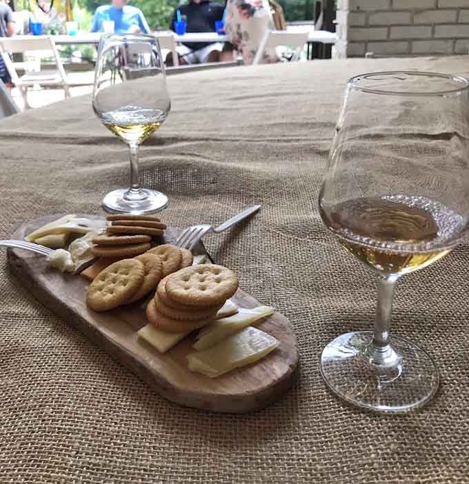 Crackers, cheese, and wine create the holy trinity of simple pleasures done exactly right.