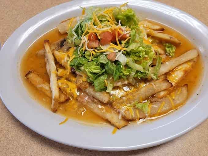 When your burger comes with fries and enough toppings to require structural engineering, you know someone in that kitchen really cares.